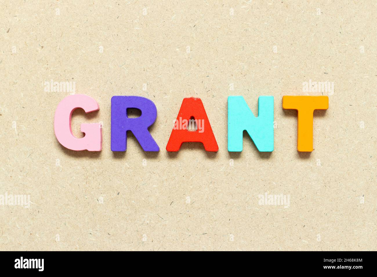 Color alphabet letter with word grant on wood background Stock Photo ...