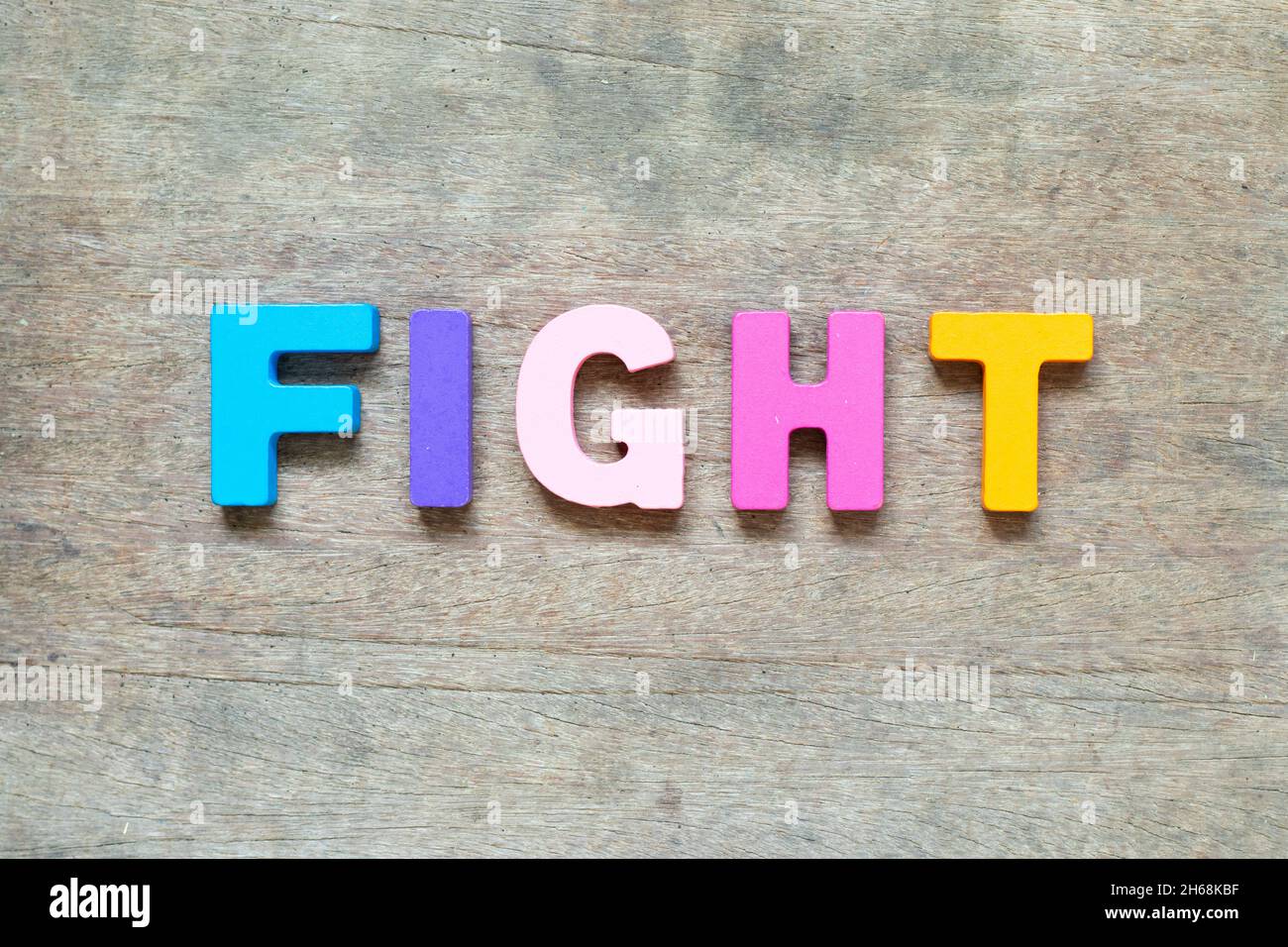 Color alphabet letter with word fight on wood background Stock Photo ...