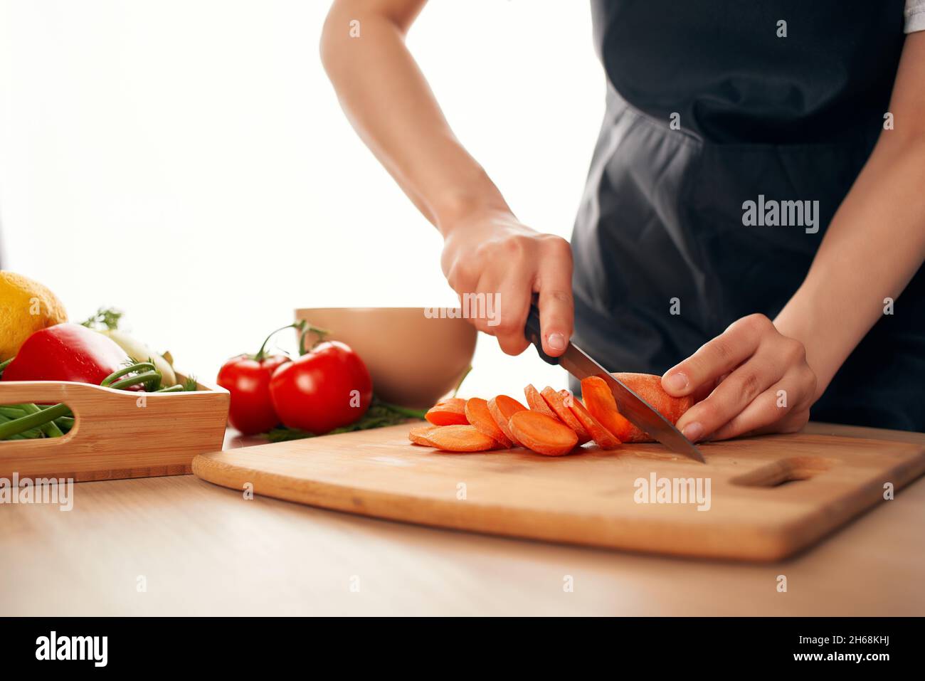 cooking salad adding ingredients healthy food kitchen Stock Photo - Alamy