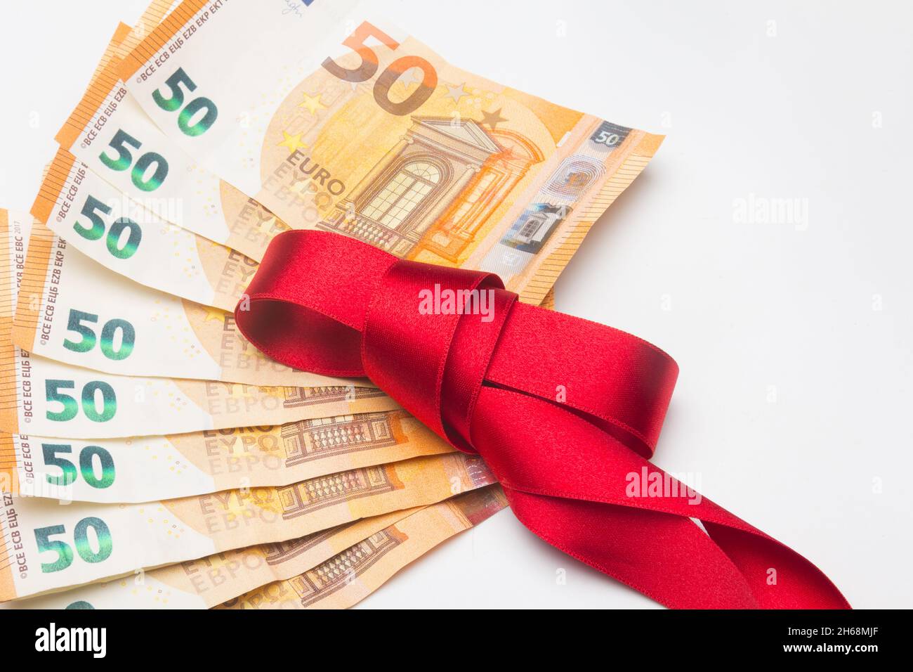 money bills with red gift bow Stock Photo - Alamy