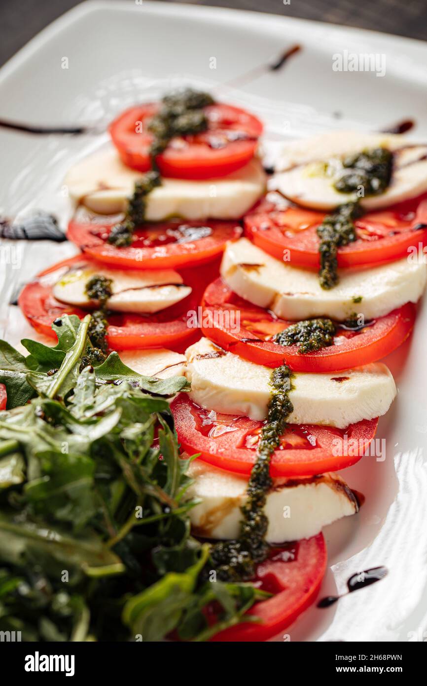 Italian caprese salad with mozzarella and tomatoes Stock Photo - Alamy