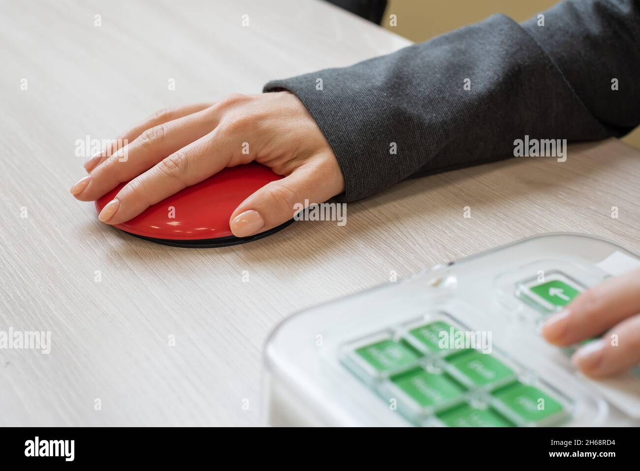 Woman with cerebral palsy works on a specialized computer mouse Stock ...