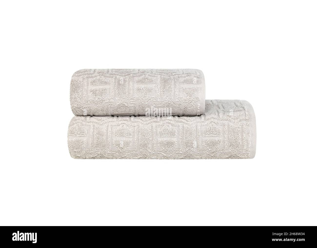 Beige duvet, blanket or bedspread. Wafer towels stack, grey towels in ...