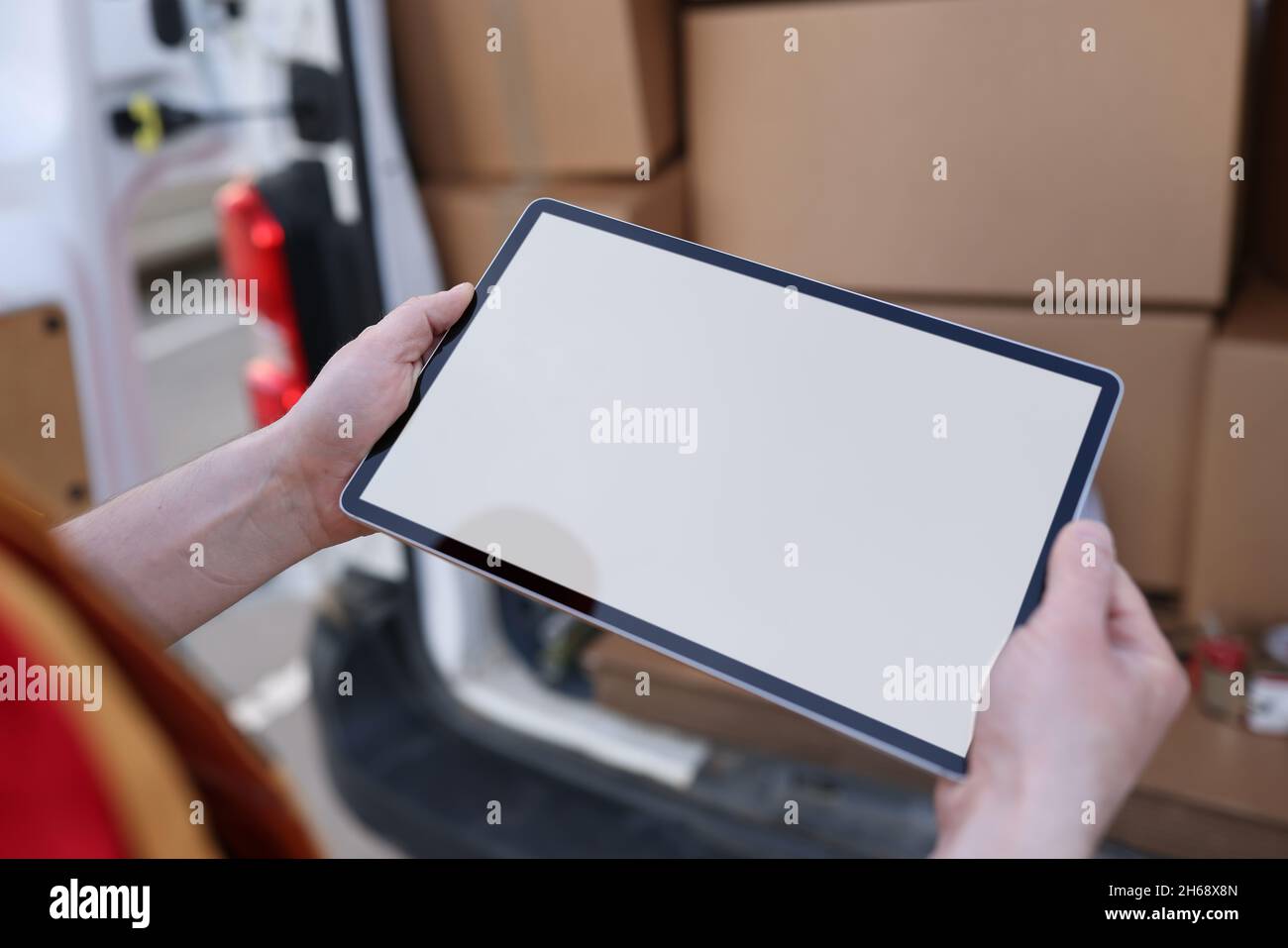 Courier hands hold tablet with blank screen, mocap Stock Photo - Alamy