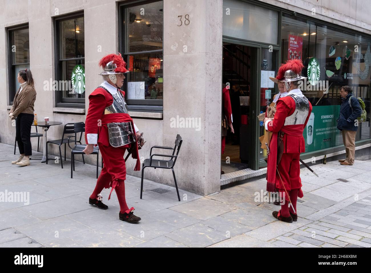 Ceremonial soldiers queue for coffee at Starbucks before joning the ...