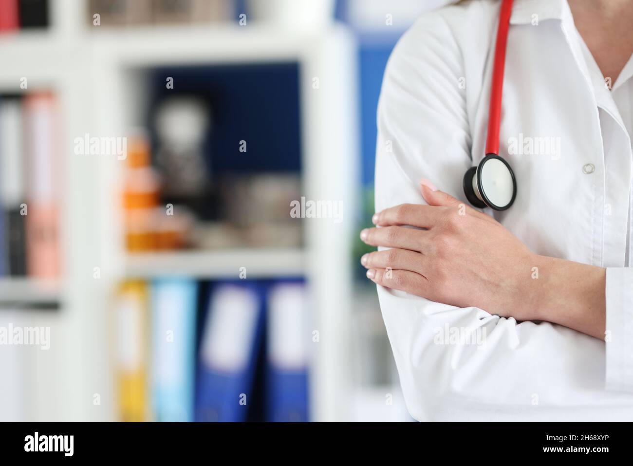 Woman arms across chest hi-res stock photography and images - Alamy