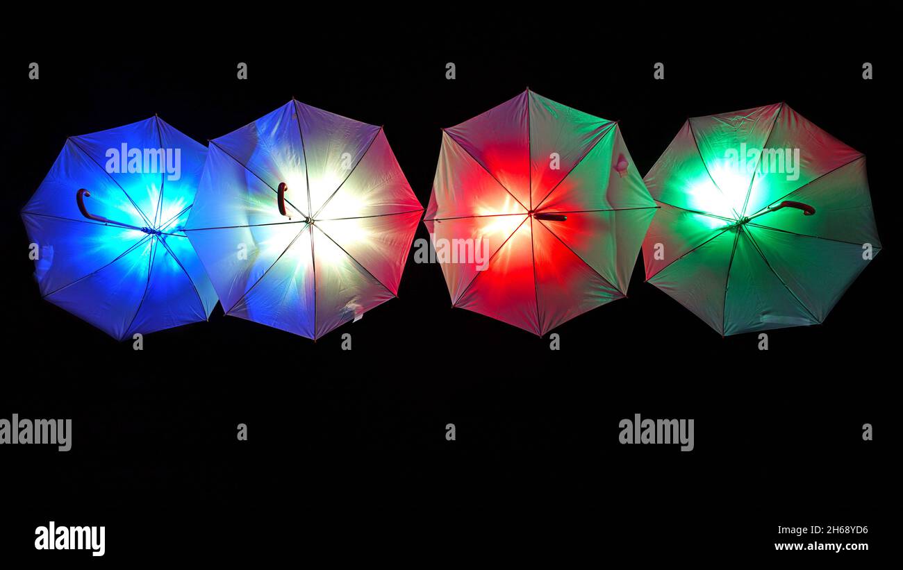 colorful illuminated umbrellas with light Stock Photo - Alamy