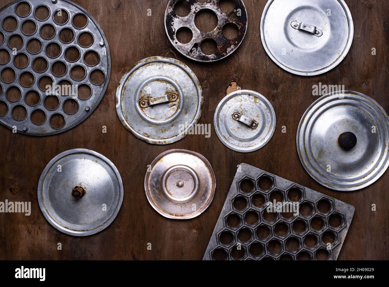 Old iron lids for vintage pot Stock Photo - Alamy