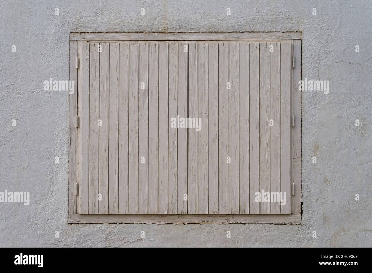 Detailed view of a closed wooden window painted white with a lot of ...
