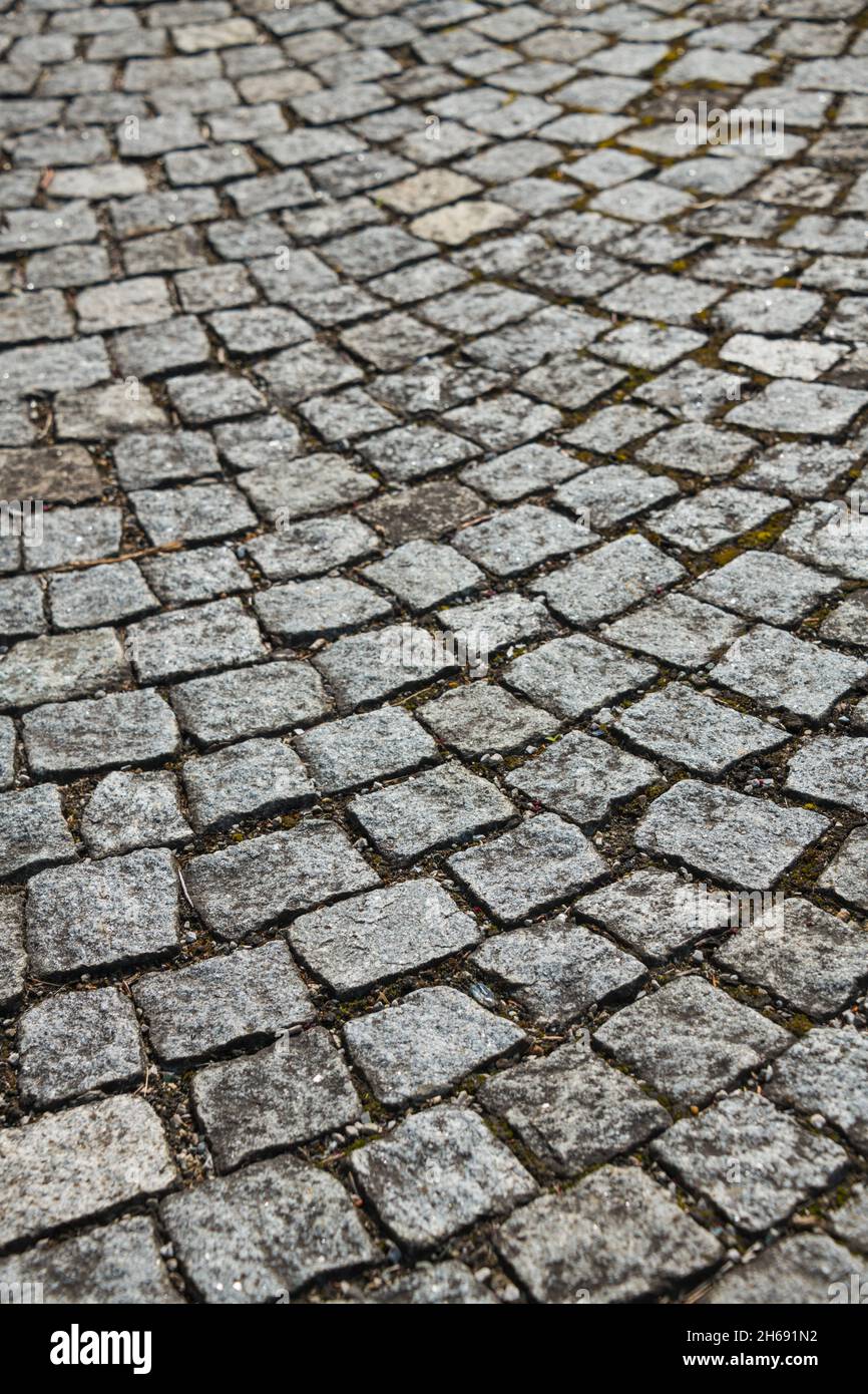 Street paving with square granite paving stones to use as background ...