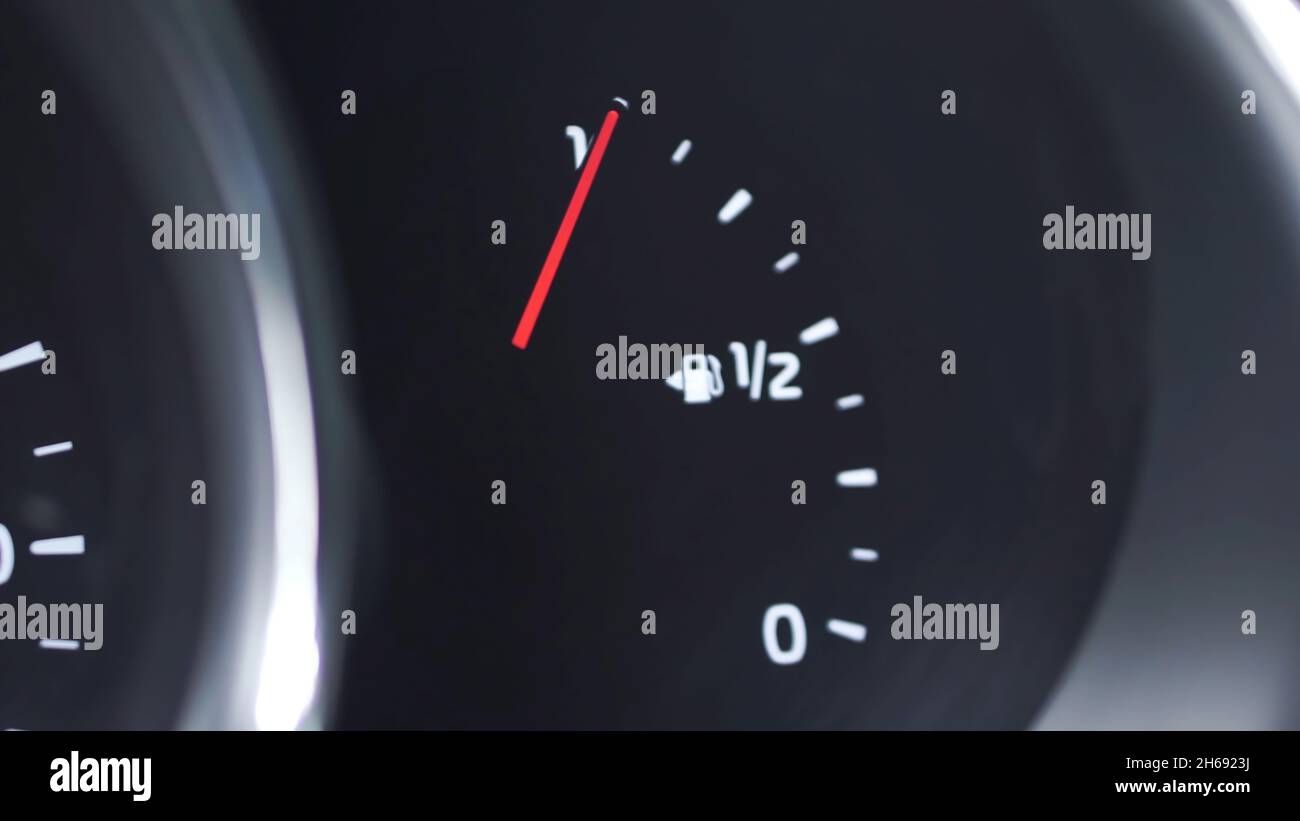 Close-up car dash board petrol meter, fuel gauge, with over full ...
