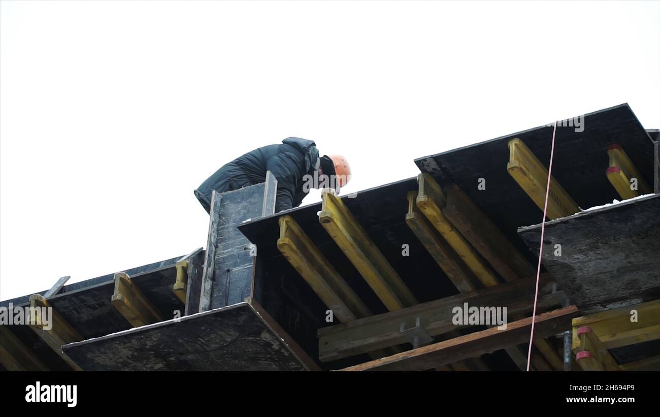 Construction worker working on a construction site. Clip. Employee ...