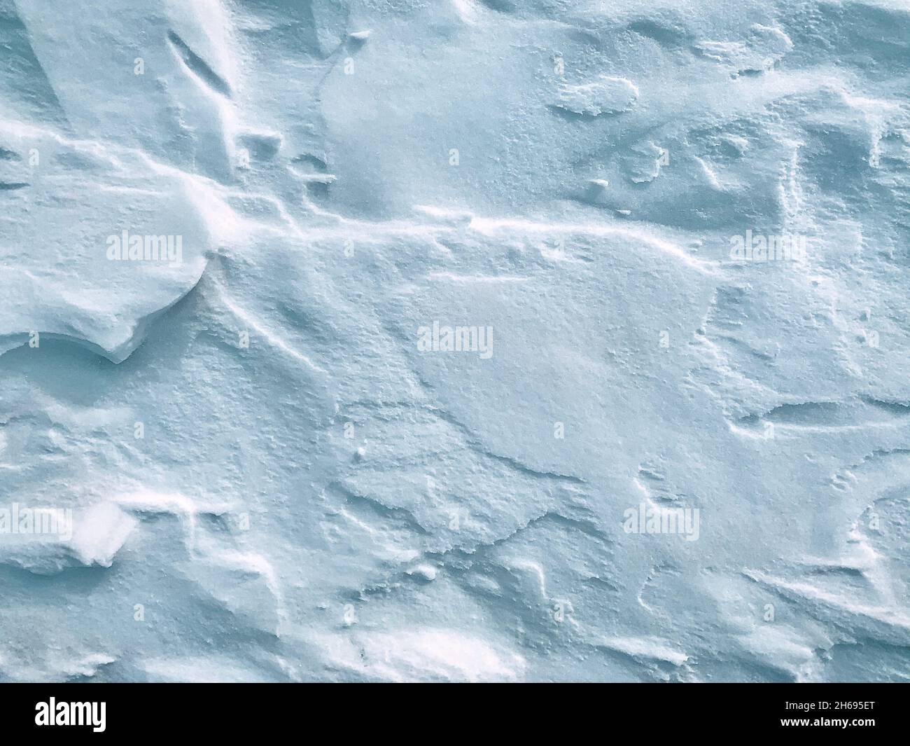 Snow is a natural background. Texture applied by layers of wind Stock ...