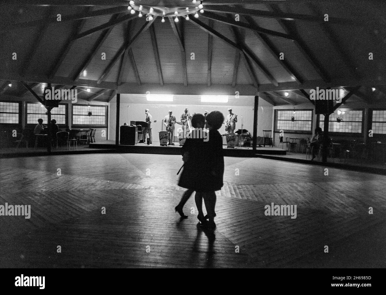 two girls in last dance on empty dance floor photo: Bo Arrhed Stock ...