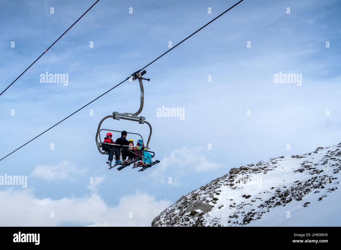 Ski Resort Chair Lift with skiers. Family. Snow Stock Photo - Alamy