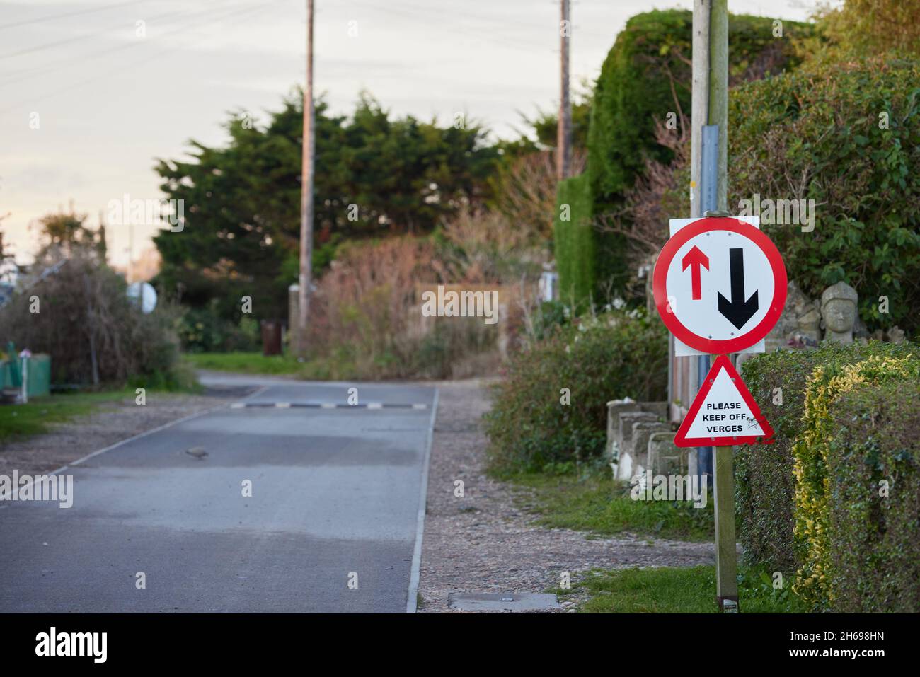 Give way to oncoming vehicles road traffic sign Stock Photo - Alamy