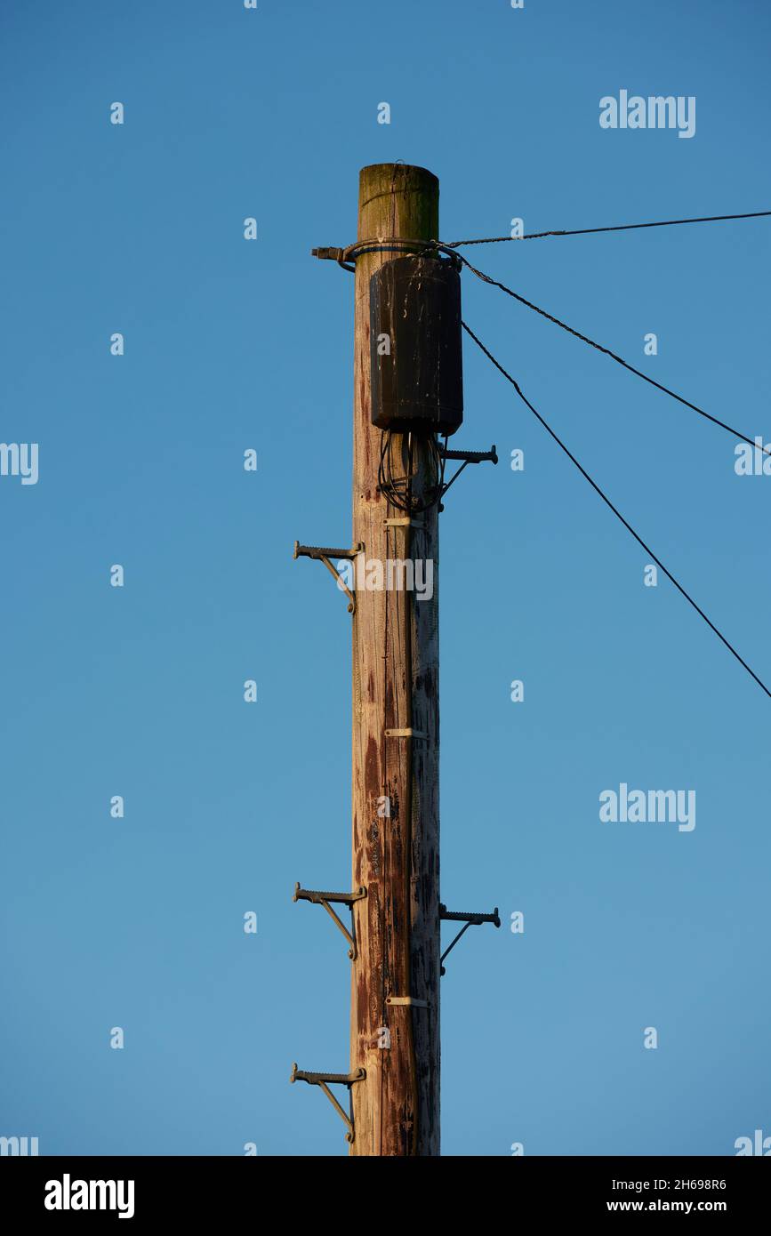 Close up of top of telephone post with wires Stock Photo - Alamy