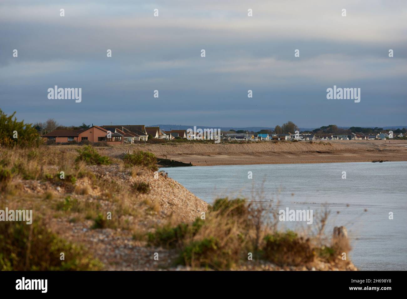 View of Pagham houses on the coast Stock Photo - Alamy