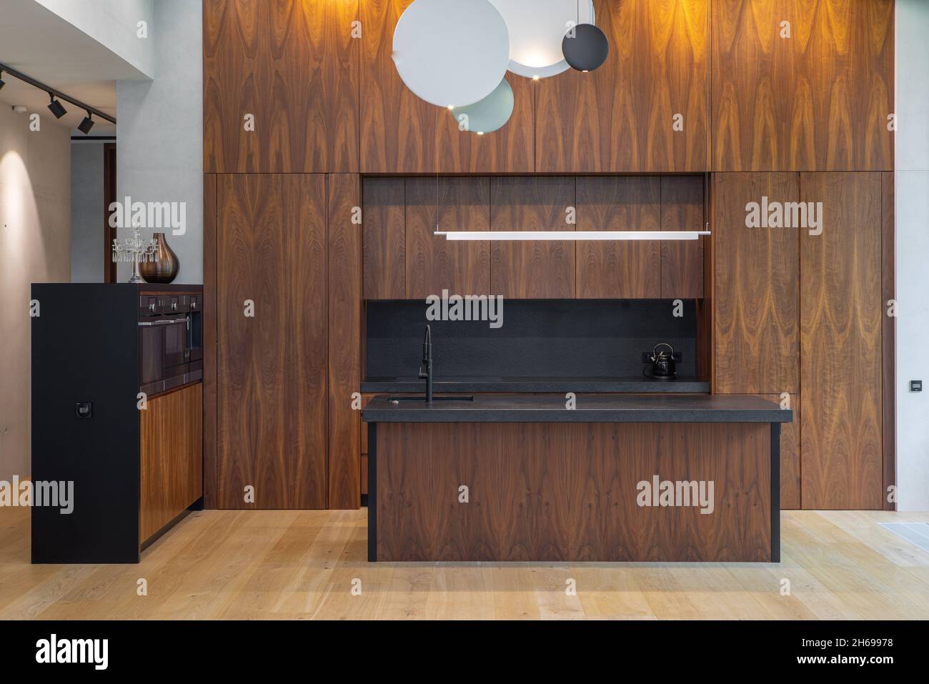 Modern interior of luxury apartment. Stylish wooden kitchen. Black ...