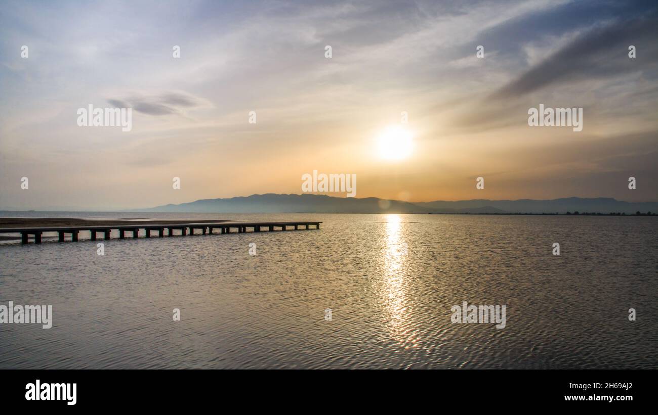 A long wooden pier on the sea Stock Photo - Alamy