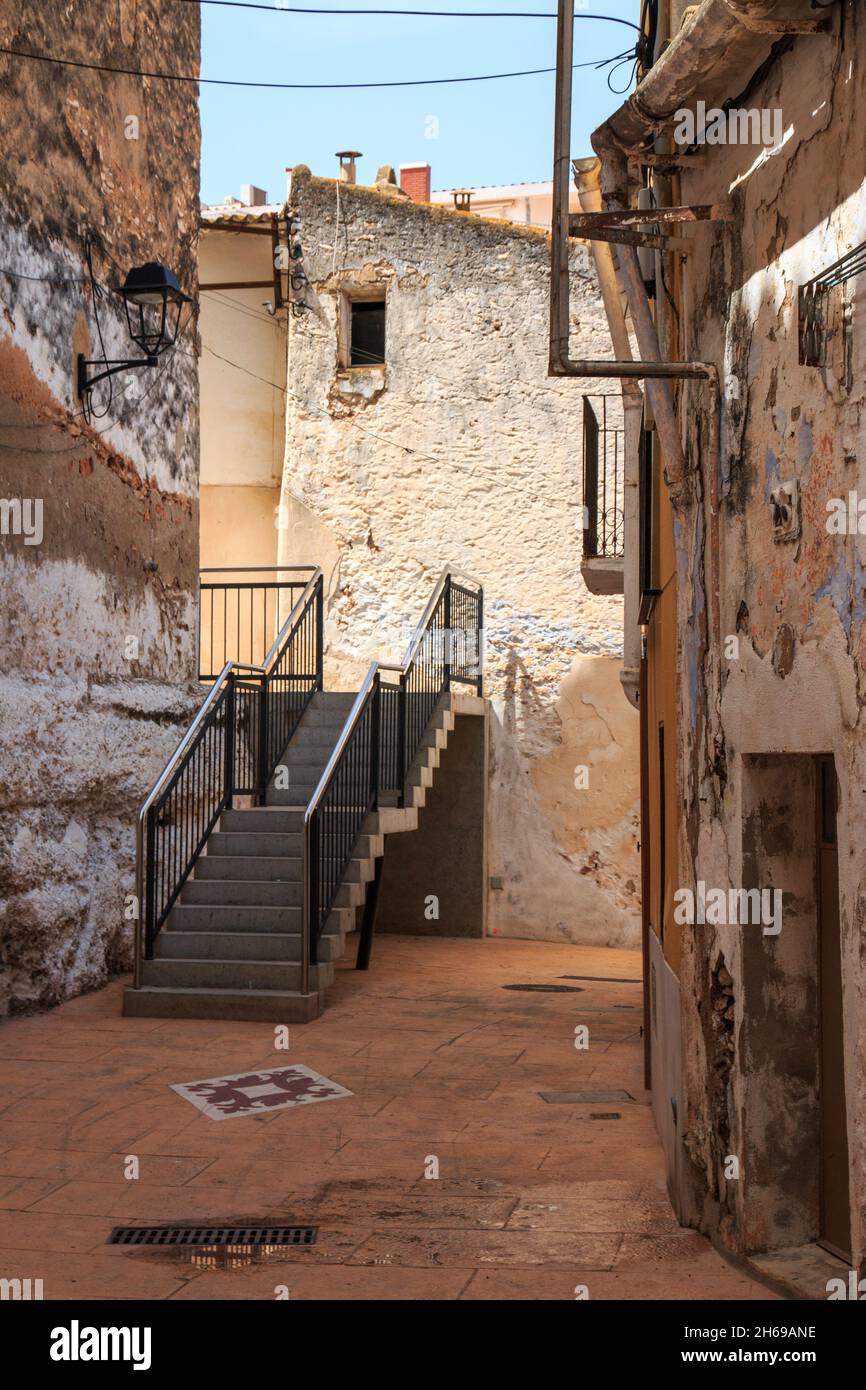 A small corner between the old stone buildings in Tortosa, Spain Stock ...