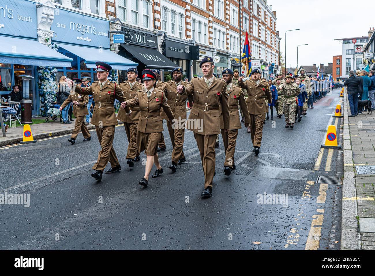 WIMBLEDON LONDON, UK. 14 Nov, 2021. Members of the armed forces followed by cadets march through ...