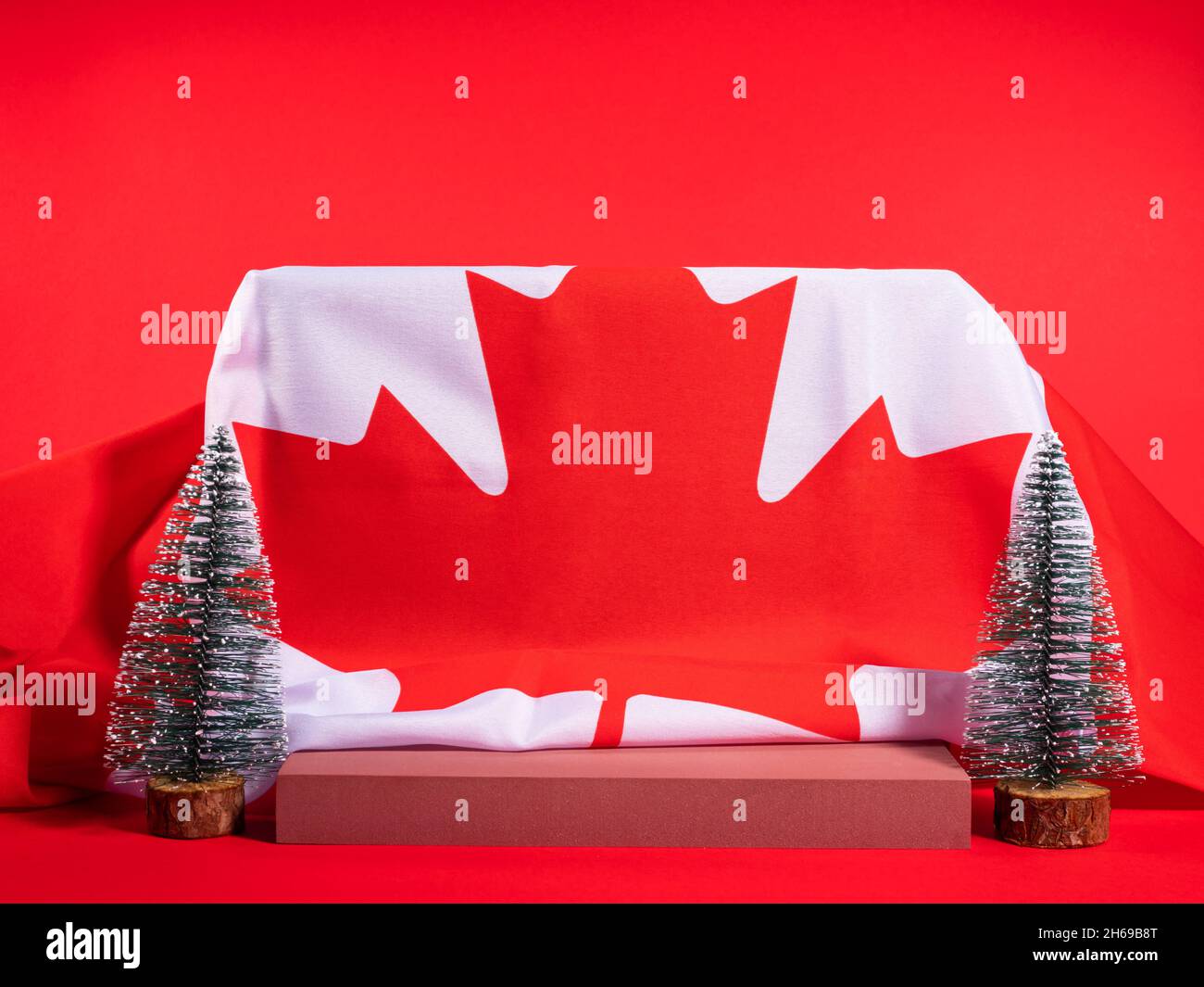 Christmas winter podium mockup on red background with canadian flag ...