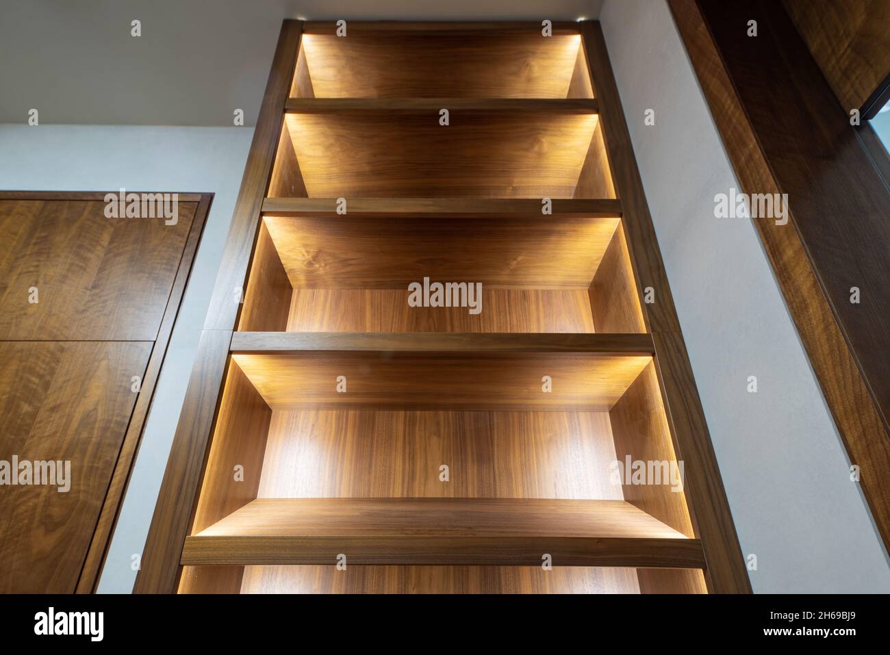 Modern interior of luxury apartment. Close-up of illuminated wooden ...