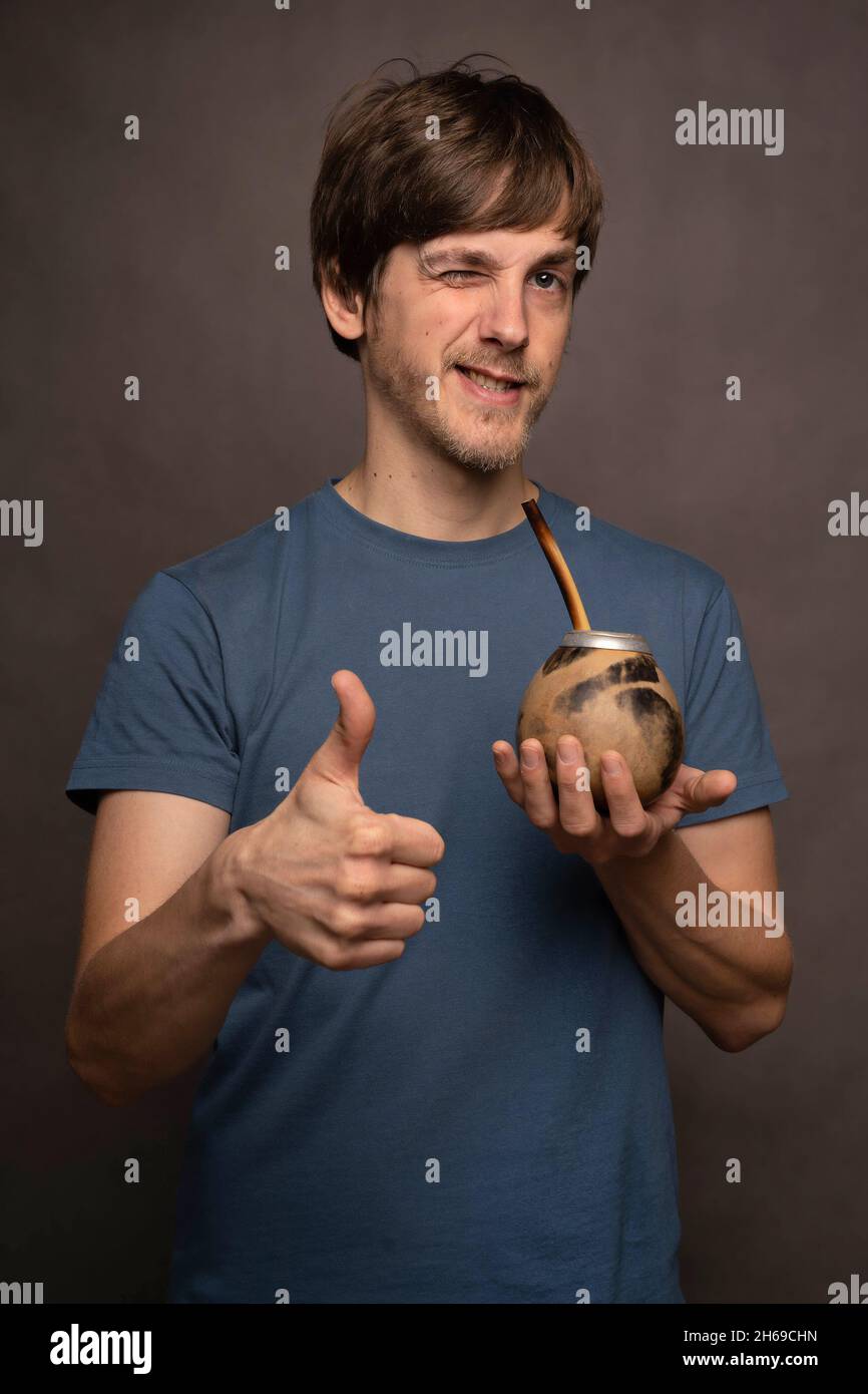 Young handsome tall slim white man with brown hair doing thumbs up ...