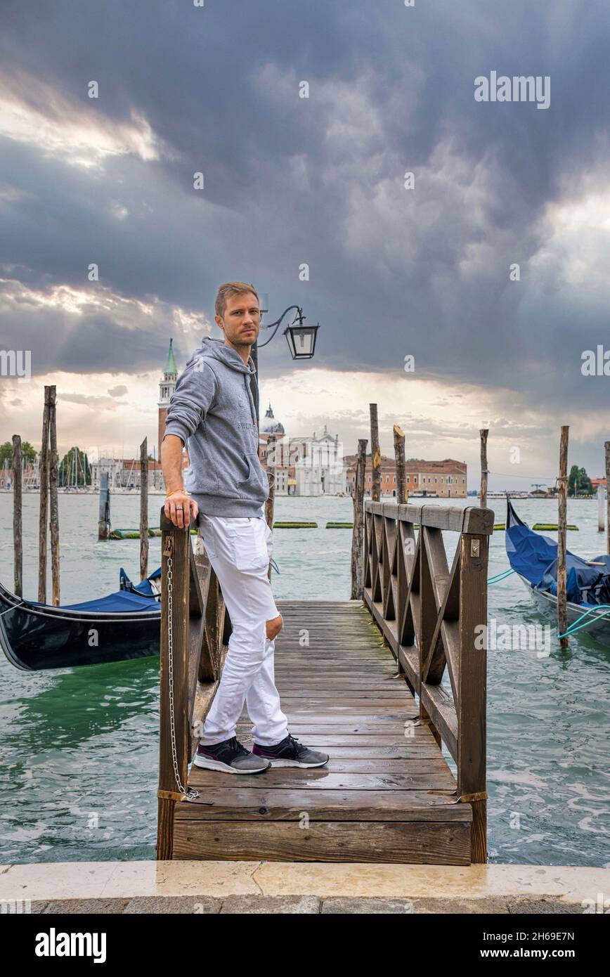 Man leaning over railing hi-res stock photography and images - Alamy