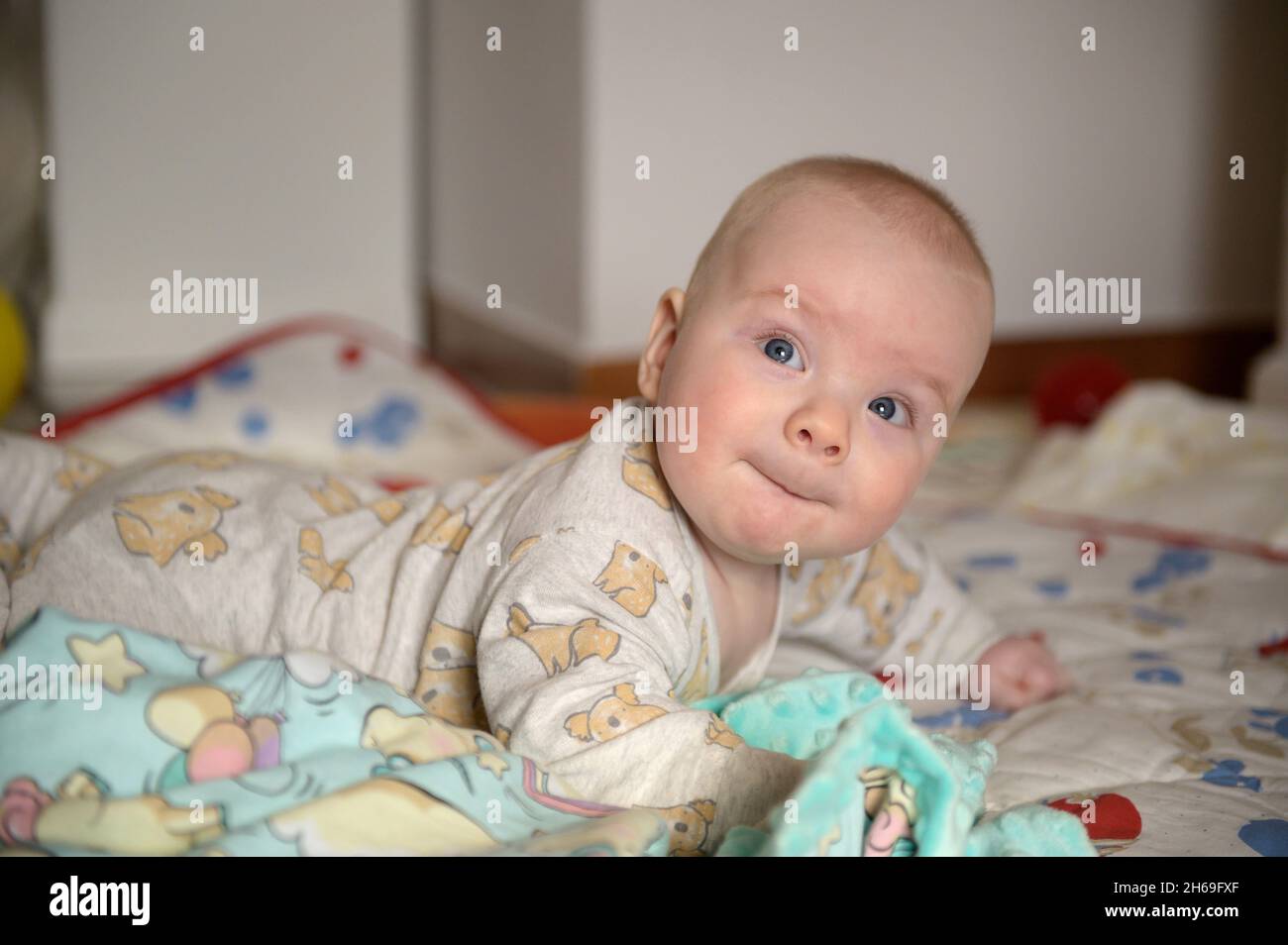 Cute baby playing inside home Stock Photo - Alamy