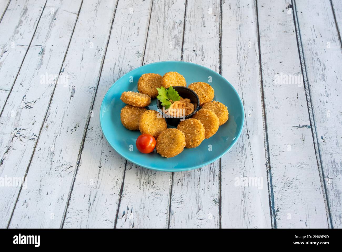 Chicken nuggets in blue hi-res stock photography and images - Alamy