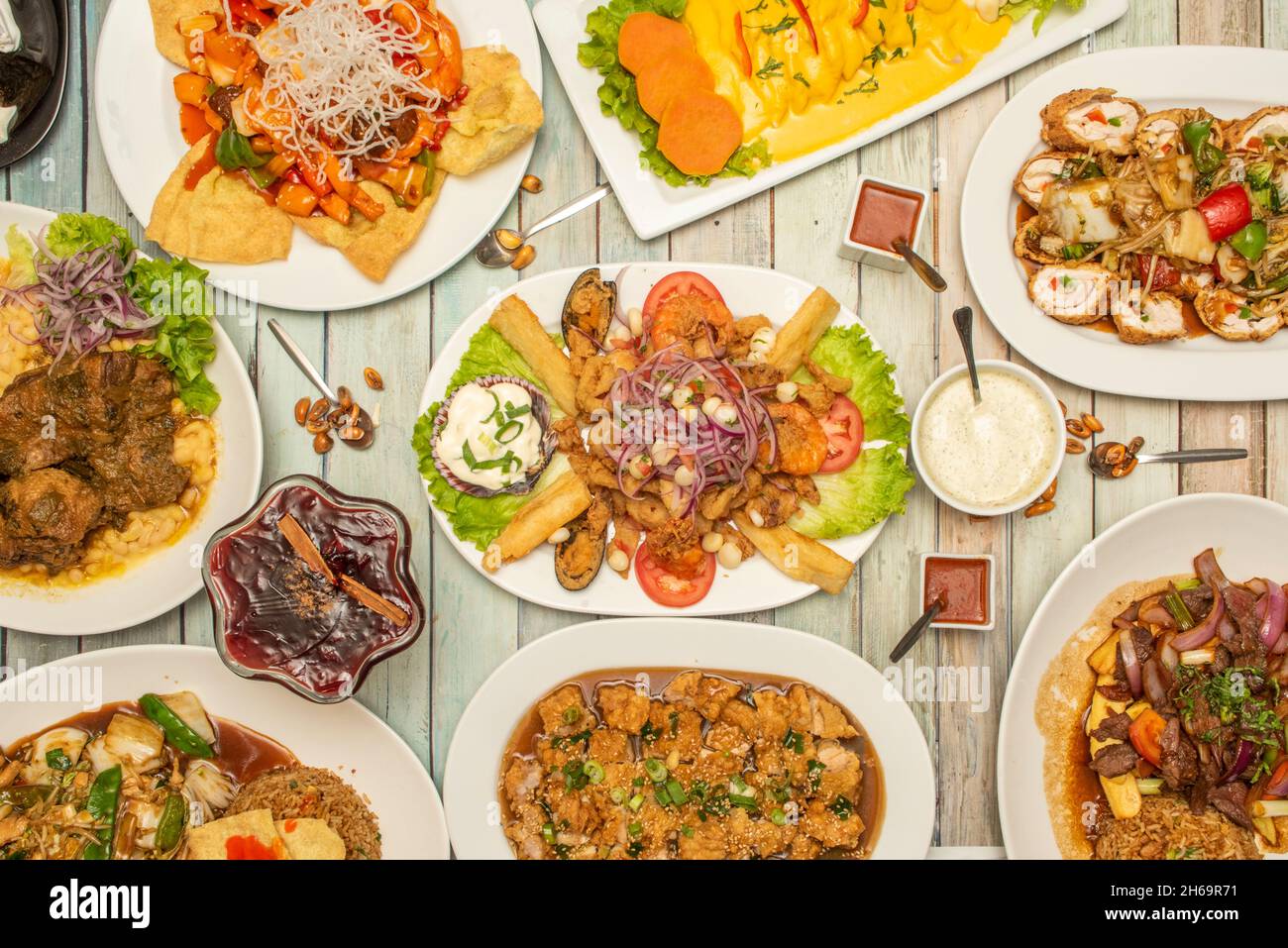 Selection of Peruvian dishes with seafood jelly, wantan with vegetables ...