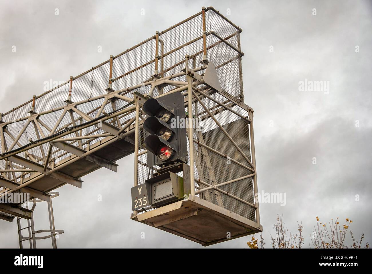 Overhead signal light for trains at the end of a platform set to red ...