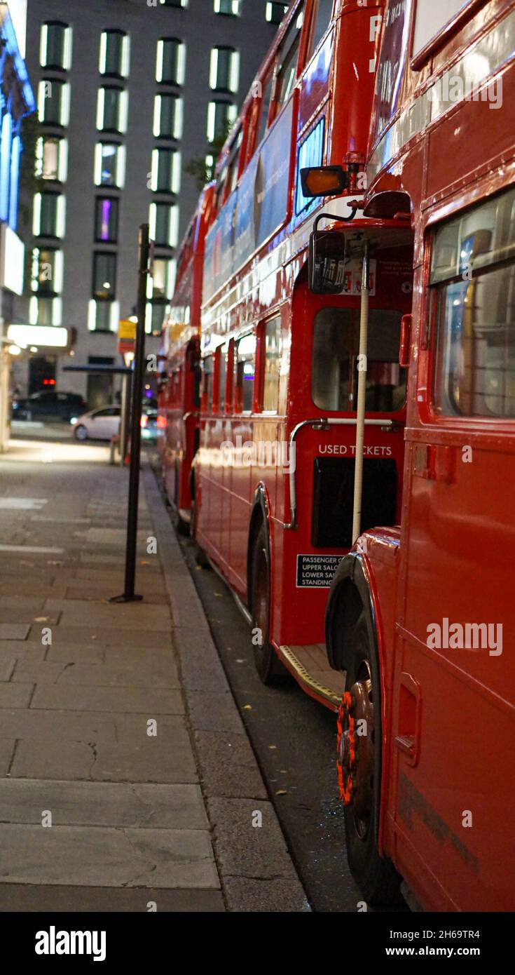 A vertical shot of parked red buses in London, United Kingdom Stock ...