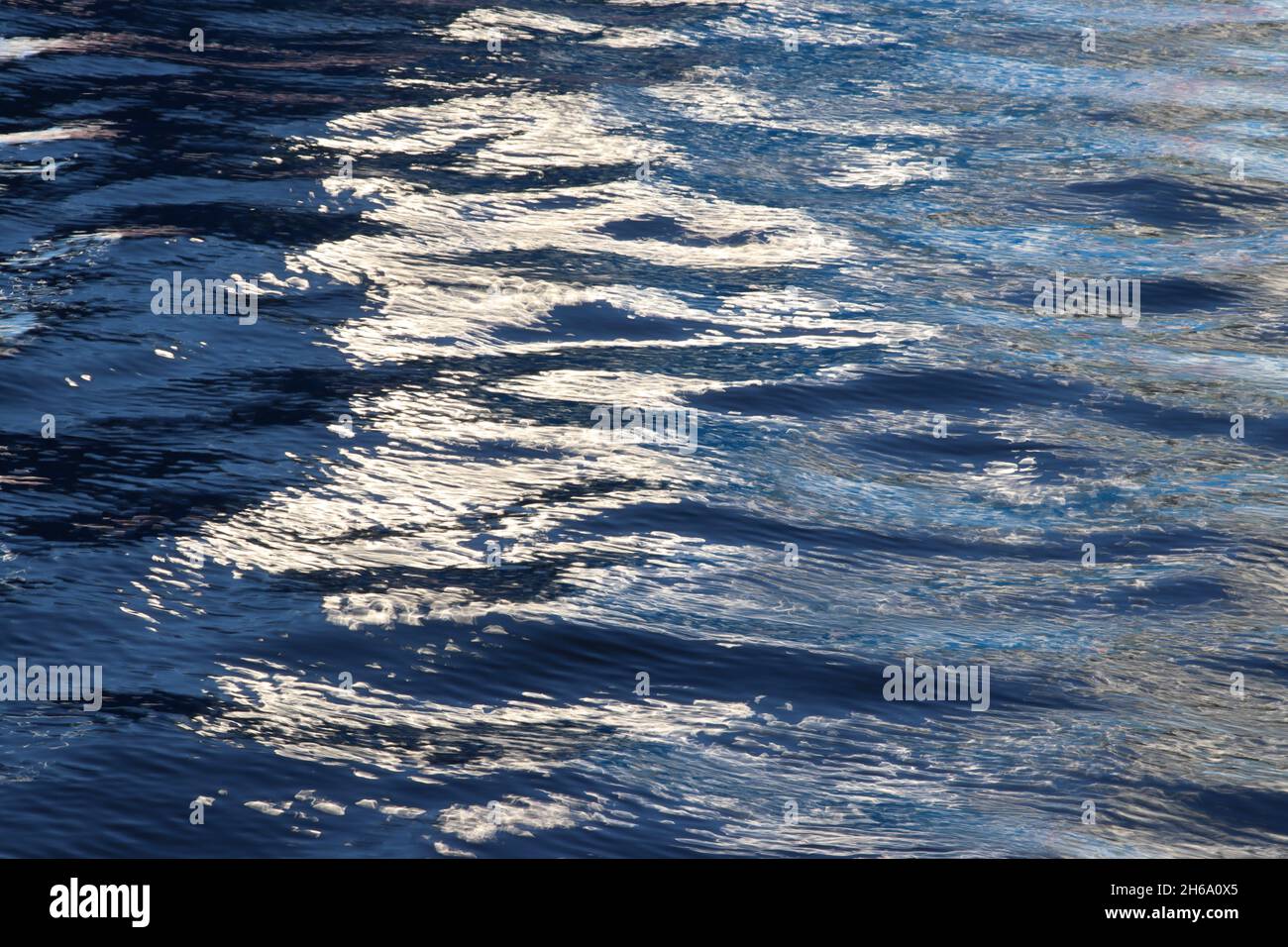 Patterns and colours in reflections of boats in harbour water Stock ...