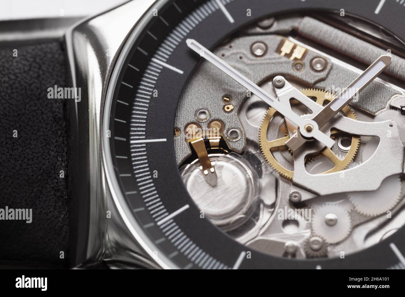 Swiss made quartz skeleton wrist watch, black deal and hands. Close-up ...