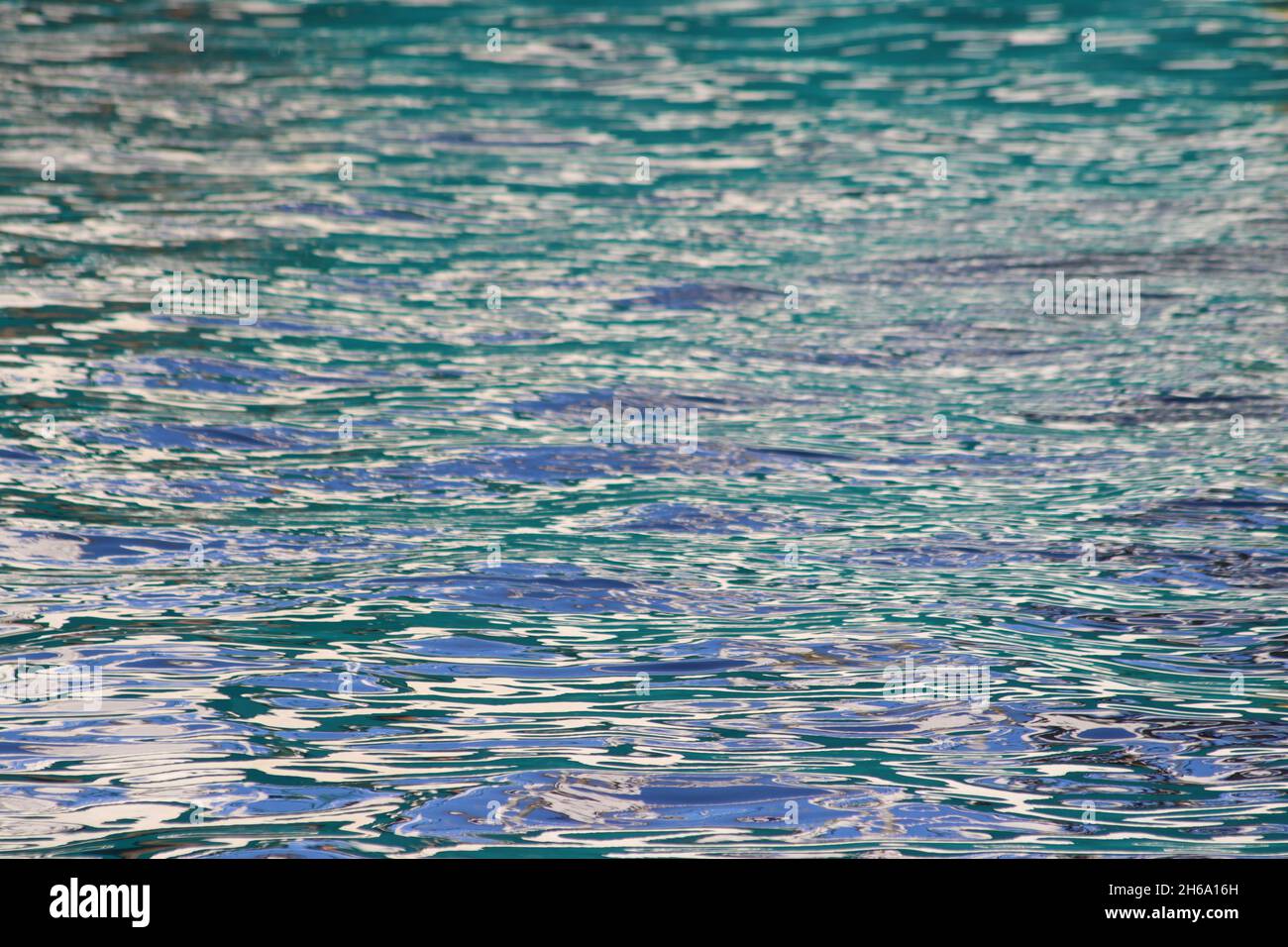 Patterns and colours in reflections of boats in harbour water Stock ...