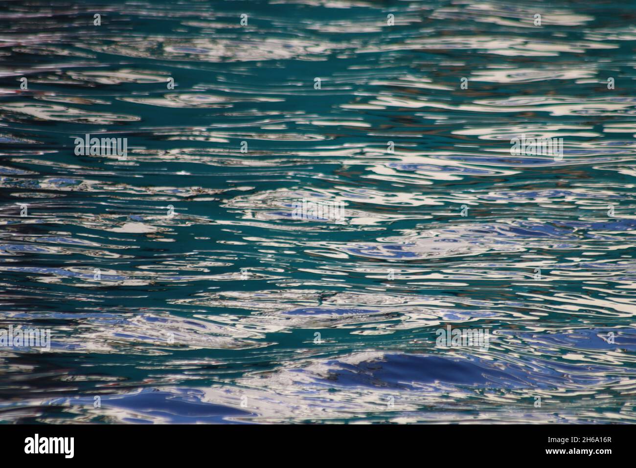 Patterns and colours in reflections of boats in harbour water Stock ...