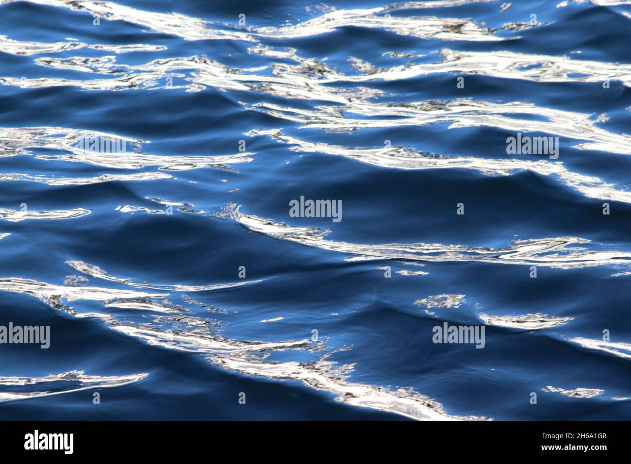 Patterns and colours in reflections of boats in harbour water Stock ...
