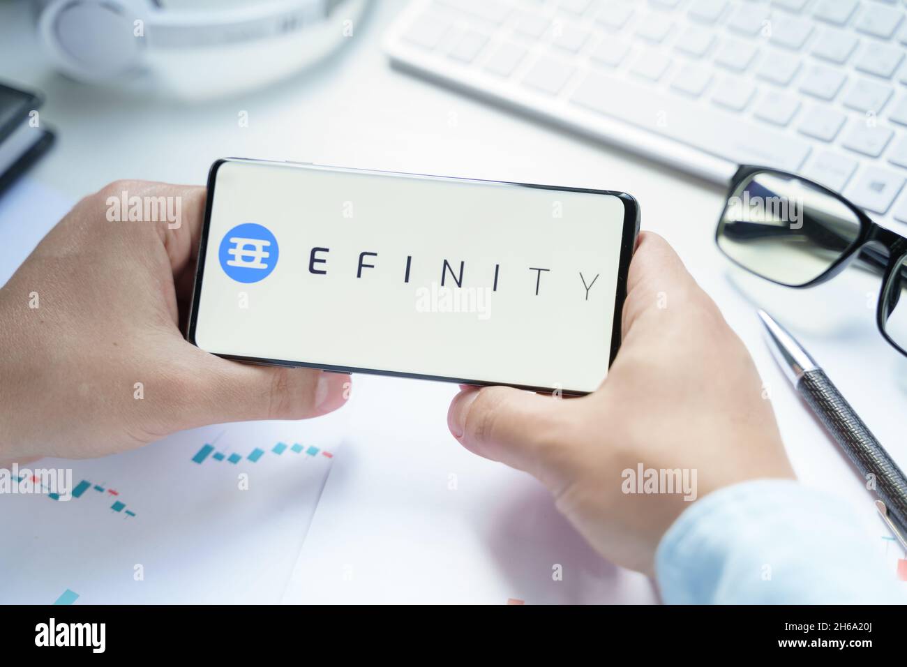 Russia, Moscow 08.06.2021. Mobile phone with logo of Efinity, EFI token. Next-generation ...