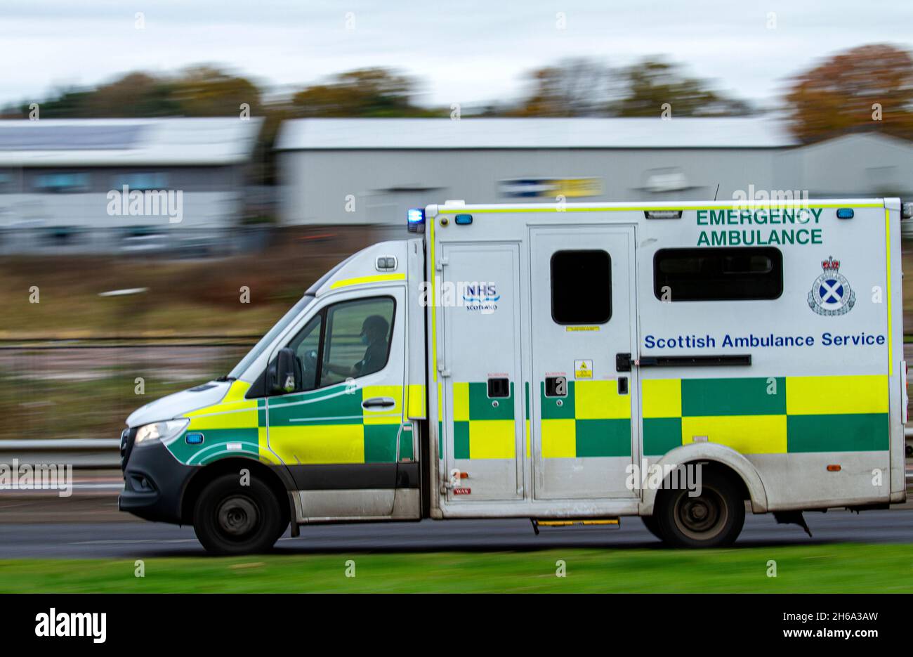 Scottish Ambulance Service emergency ambulance responding at great speed to an 999 call along ...