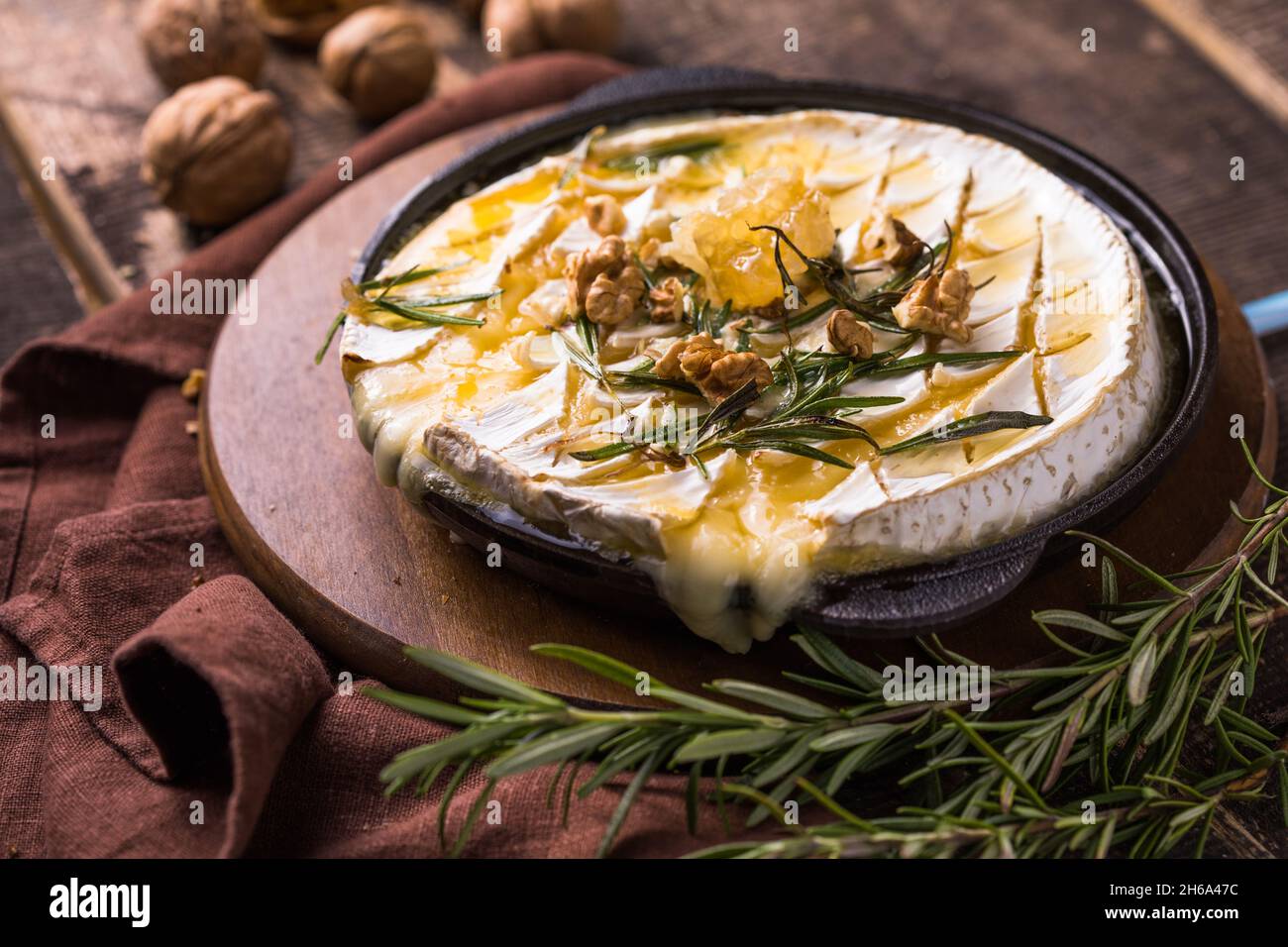 roasted Camembert or Brie with rosemary, honey, nuts Stock Photo - Alamy