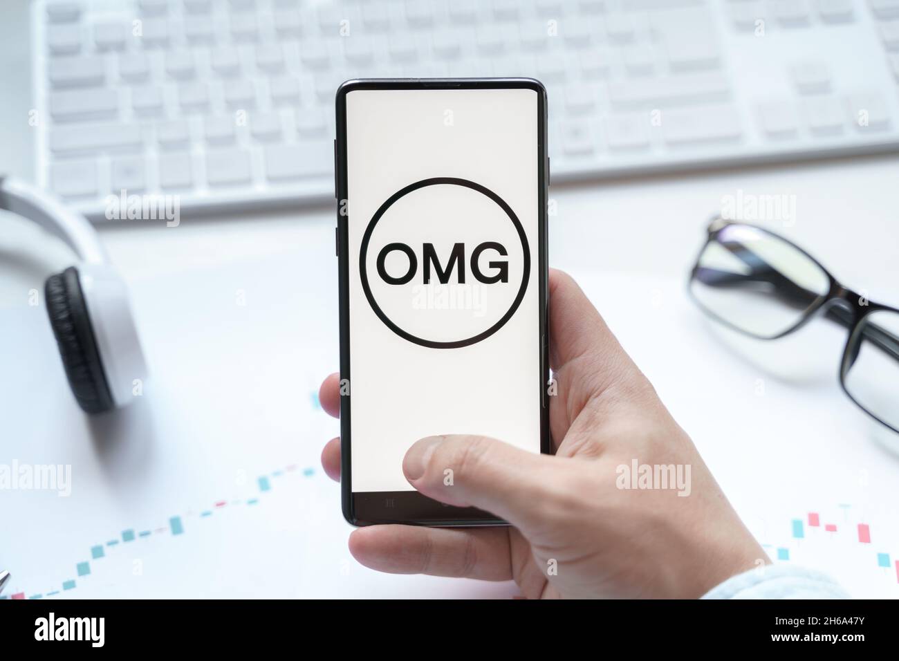 Russia Moscow 08.06.2021. Logo with OMG, OmiseGO Network in mobile ...