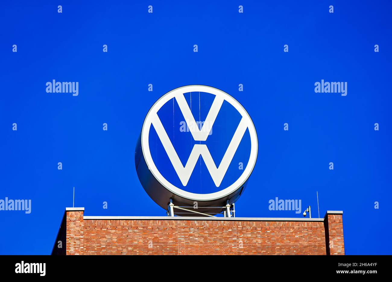 Huge round VW logo on the high-rise roof of the car company's ...