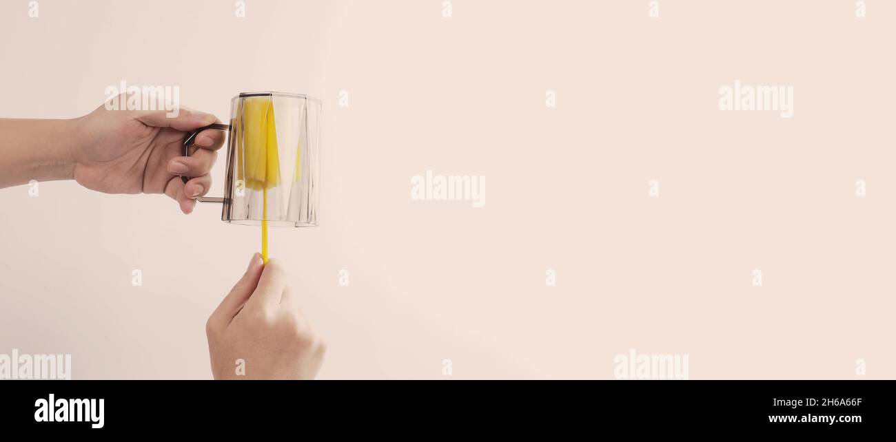 Clean and wash dish concept. Man hand washing drink glass on white ...