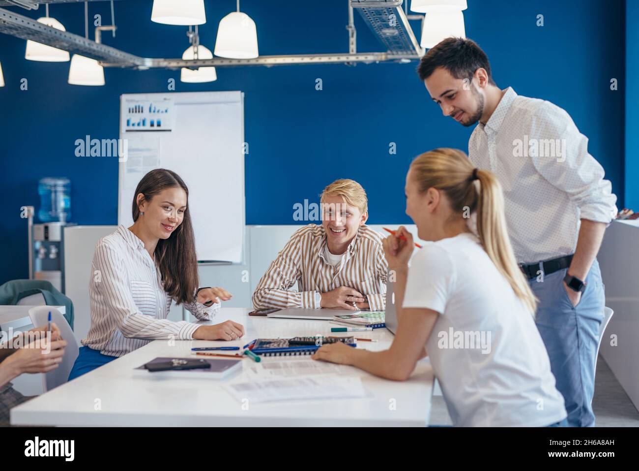 Group man gather table hi-res stock photography and images - Alamy
