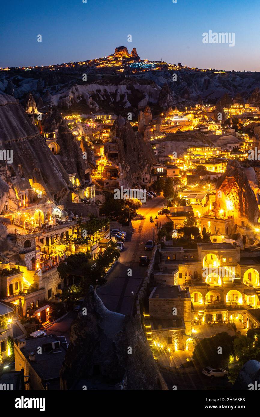 A vertical shot of a road surrounded by illuminated historical ...