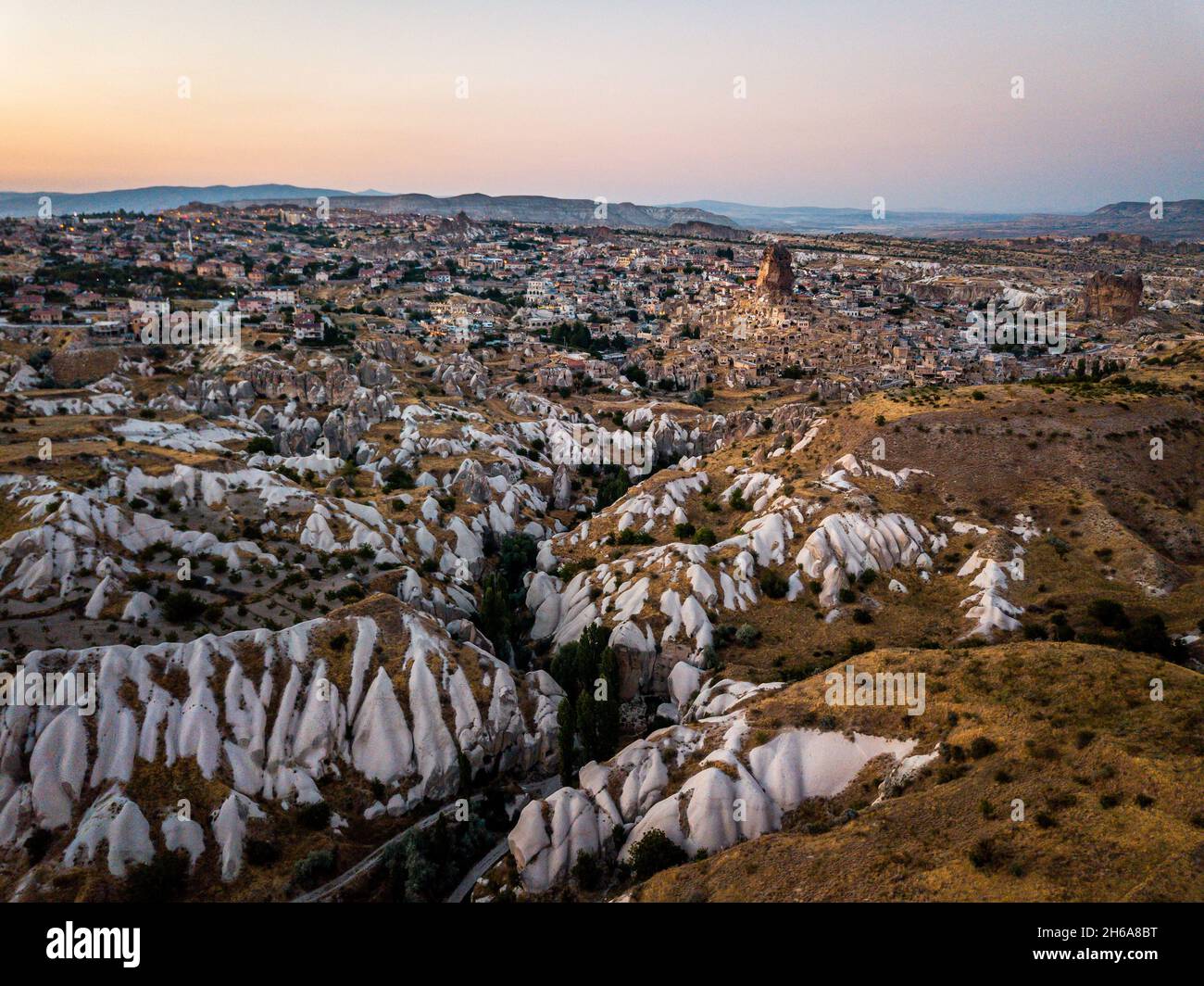 A landscape of hills and rock formations under the sunlight in ...