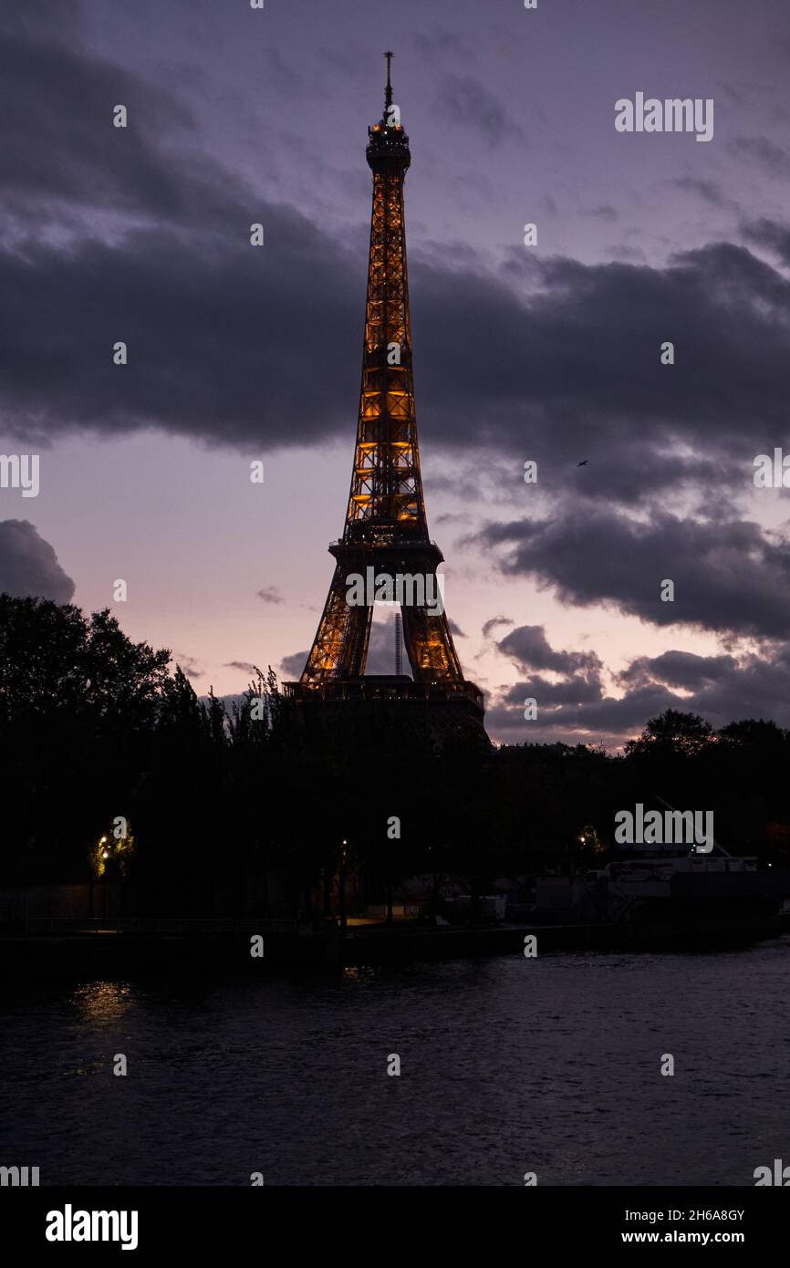 The Iconic Eiffel Tower with Lights on at Dusk or Night - View from ...